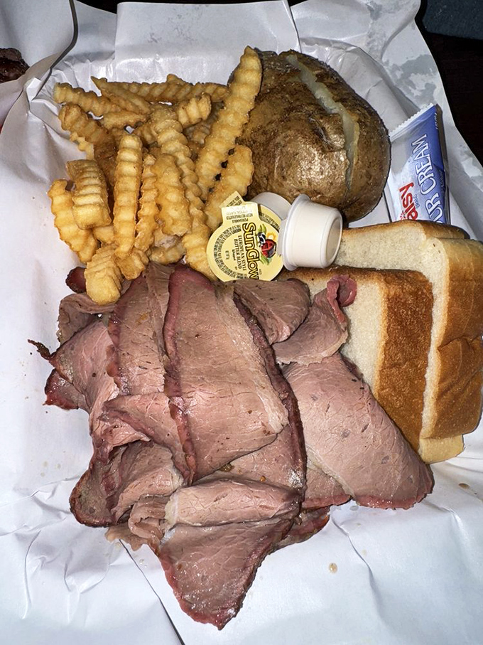 Brisket so tender it practically surrenders at the sight of your fork. That smoke ring is the BBQ equivalent of a Michelin star.