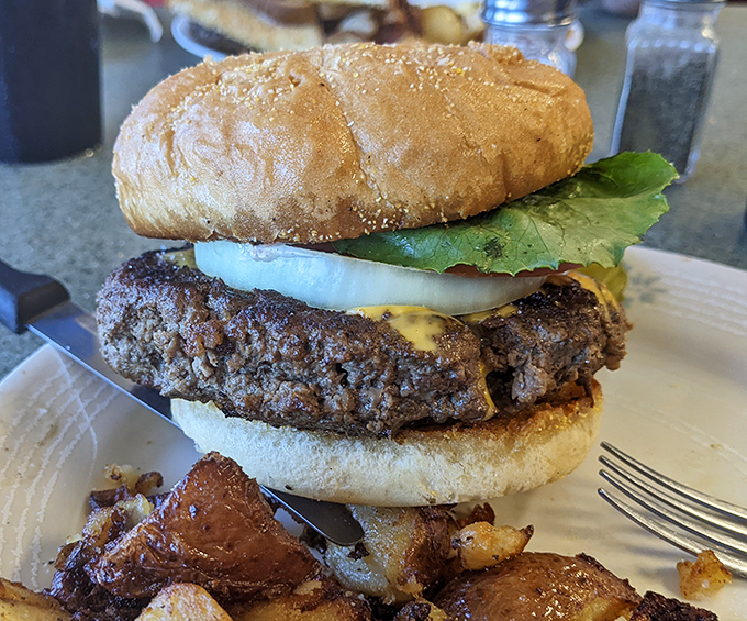 The burger that launched a thousand napkins. That perfectly charred patty is the reason stretchy pants were invented.