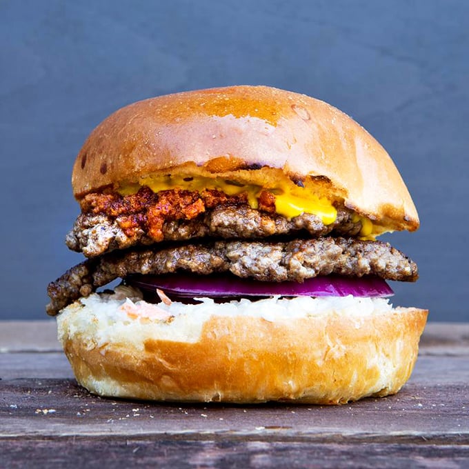 This burger doesn't need fancy aioli or truffle-infused anything to make a statement. It speaks the universal language of "get in my belly now."