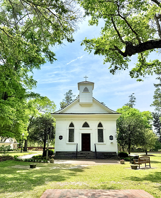 The Lebanon Chapel provides a serene white landmark amid the greenery, its simple elegance a testament to timeless Southern architecture.