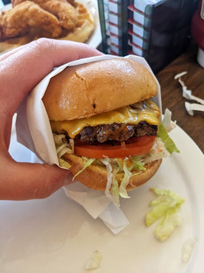 Not just a burger, but a hand-held masterpiece of beef, cheese, and fresh veggies that makes fast food chains weep with inadequacy.