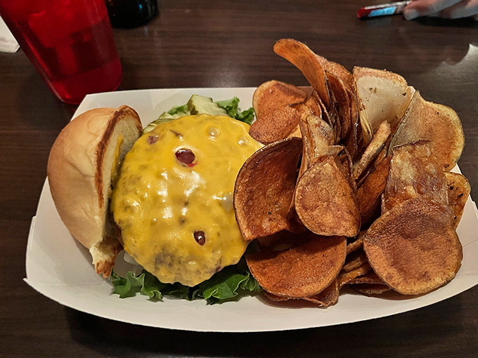 A classic cheeseburger on a pretzel bun with hand-cut fries &ndash; sometimes simplicity is the ultimate sophistication.