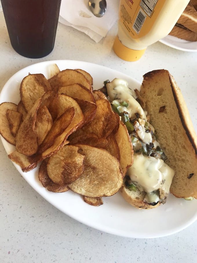 This sandwich isn't just a meal&mdash;it's an engineering marvel of melted cheese, tender filling, and house-made chips that crunch loud enough to turn heads.