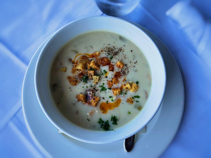 Clam chowder that doesn't hide behind excessive cream – each spoonful reveals treasures from the deep, crowned with perfect golden croutons.