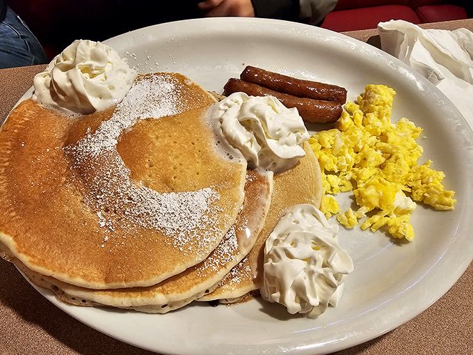 Pancakes so fluffy they practically hover, paired with eggs and sausage in the breakfast trifecta that's fueled American mornings since time immemorial.