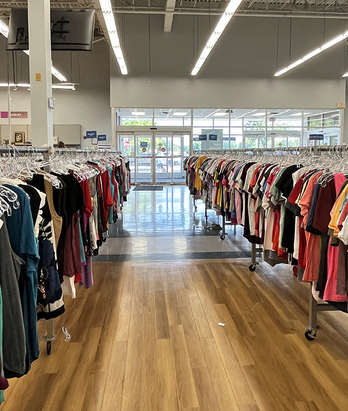 Clothing corridors stretching to infinity. The thrill of the hunt keeps shoppers pushing carts through this well-organized labyrinth of potential finds.