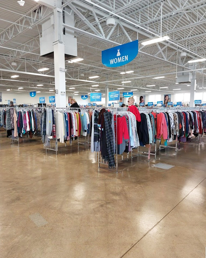 Blue signs hover like retail angels, guiding shoppers through the women's department where yesterday's fashion finds tomorrow's admirer. 