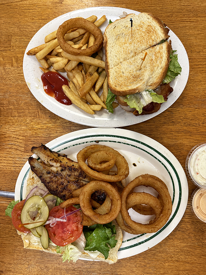The club sandwich: three layers of proof that sometimes the classics endure for a reason. Those onion rings aren't just sidekicks.