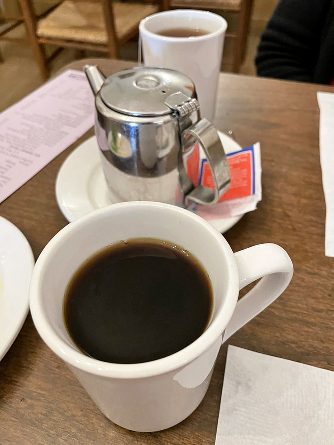 The coffee comes strong and plentiful, served in sturdy mugs that feel like they've heard decades of good morning conversations.