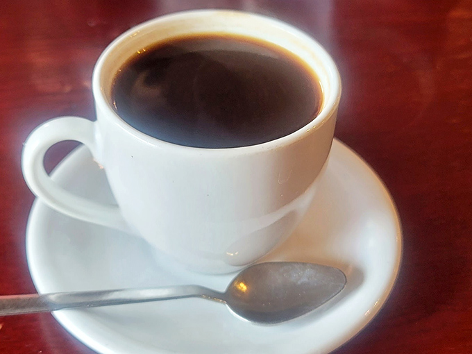 Simple pleasures: strong coffee in a white mug, served hot enough to wake you up before you even take a sip.