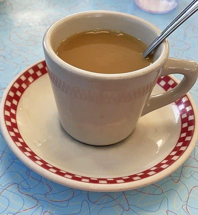 The humble diner coffee cup&mdash;holder of liquid ambition, keeper of morning dreams, and proof that sometimes the simplest pleasures are the most reliable.