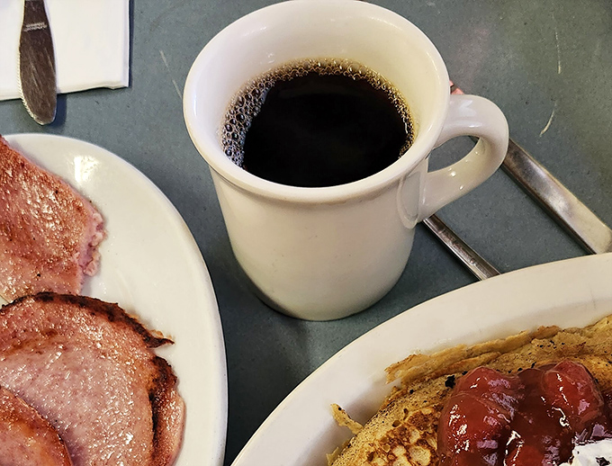 The diner coffee arrives in that perfect thick white mug&mdash;the kind that feels like shaking hands with an old friend.