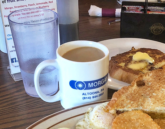 Coffee in a local business mug alongside golden French toast&mdash;the breakfast equivalent of a warm hug on a chilly Pennsylvania morning.