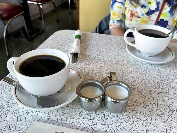 Coffee served in those iconic thick white mugs&mdash;the kind that keep your beverage hot and your conversation flowing.