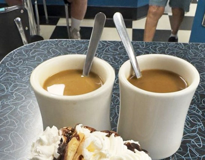 Coffee served in mugs thick enough to withstand opinions about local sports teams. The unofficial fuel of small-town America.