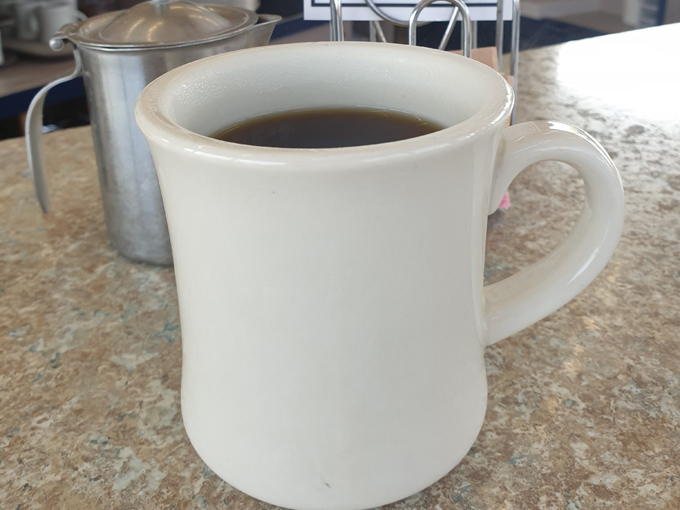 The business end of paradise, where coffee flows freely and donut dreams become delicious reality.