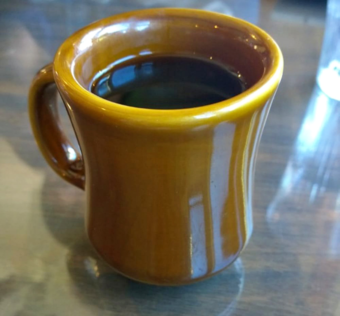 That mustard-yellow coffee mug isn't winning design awards, but what's inside has fueled mountain adventures and cured hangovers for generations.