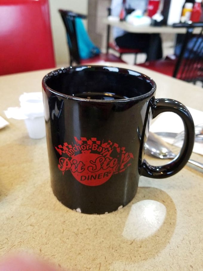 The official chalice of diner devotees – a sturdy mug emblazoned with the Pit Stop logo. Coffee always tastes better when served with a side of local pride.