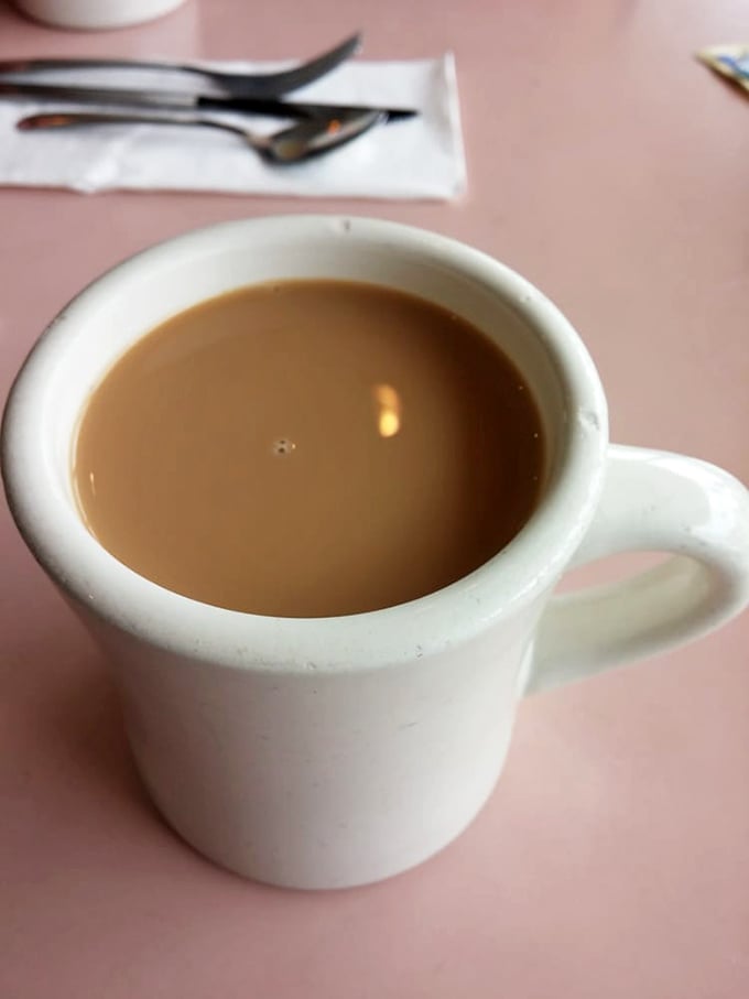 Coffee in a classic diner mug&mdash;the original therapy session. No fancy latte art needed when the coffee itself gives you a reason to face the day.