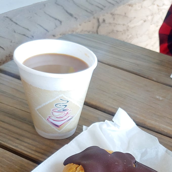 A simple cup of coffee and a chocolate-dipped treat&mdash;proof that sometimes life's greatest pleasures come in humble packages.