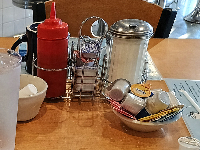 The holy trinity of diner condiments: ketchup, sugar, and salt &ndash; simple tools that transform good food into personal perfection. 