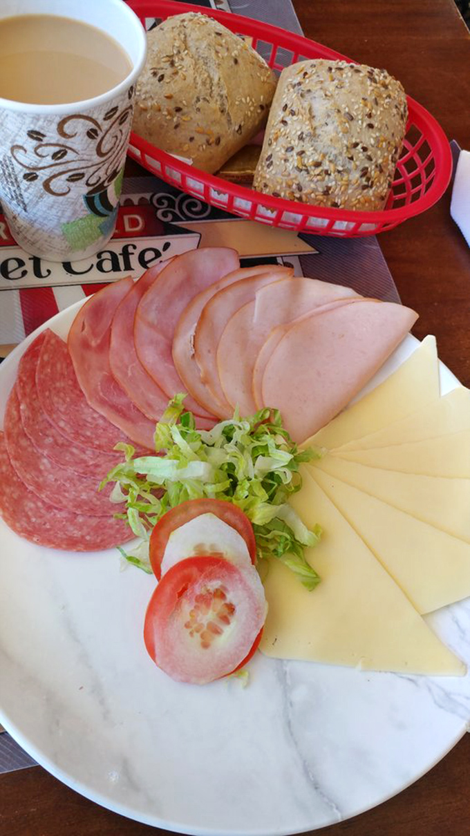 A European breakfast spread that turns morning fuel into an international affair—quality meats, cheeses, and bread that make cereal weep with inadequacy.