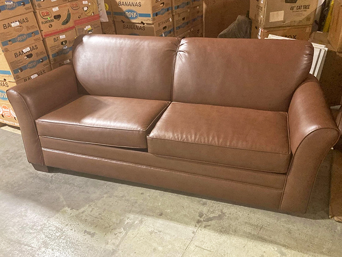 This leather couch has seen things. Now cleaned, priced, and ready for your living room, it's waiting for new memories and the inevitable nap.