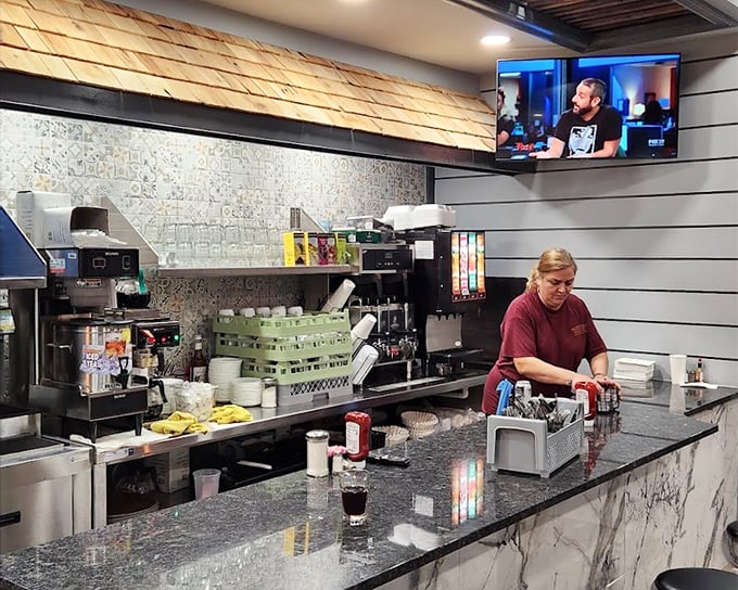 Behind every great diner is a counter where coffee magic happens. This marble-topped command center orchestrates the symphony of breakfast satisfaction.