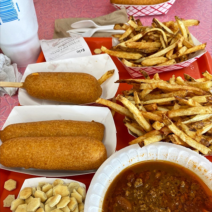 The perfect road trip fuel &ndash; two Cozy Dogs and a mountain of fries that would make any cardiologist nervously update their contact information.