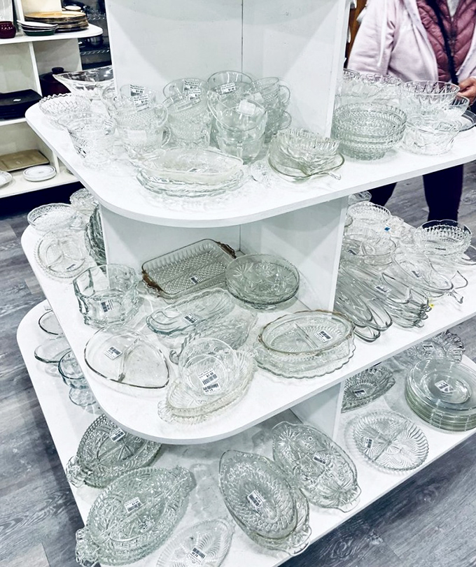 Crystal and glassware that would make your grandmother swoon, arranged like a museum exhibit of domestic elegance from bygone eras.