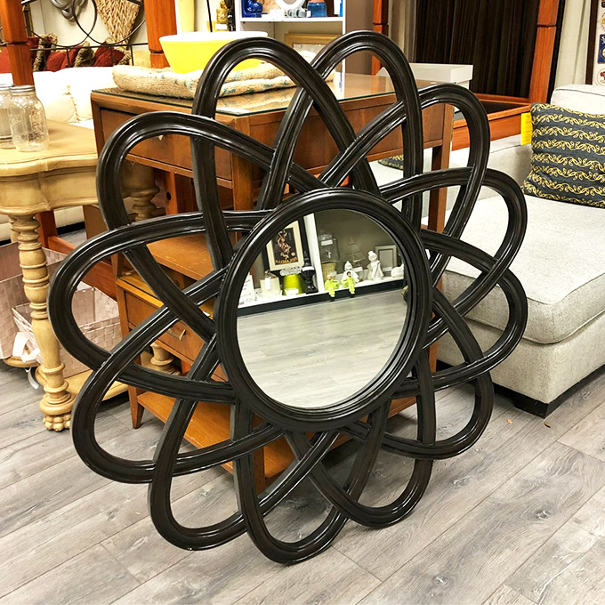 This flower-shaped mirror doesn't just reflect&mdash;it celebrates. Like a 1960s interpretation of a sunburst, it transforms any wall from mere vertical space into an artistic focal point.