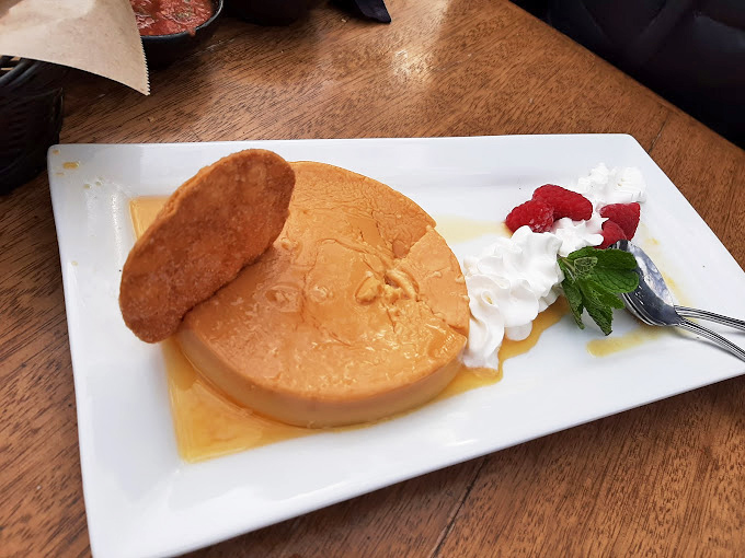 Flan that jiggles with just the right amount of commitment issues. That caramel pool isn't just showing off—it's inviting you to dive right in.