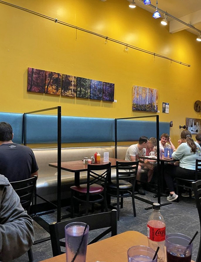 Local artwork adorns sunny yellow walls while diners enjoy that perfect breakfast buzz&mdash;the kind where conversation flows as freely as the coffee.