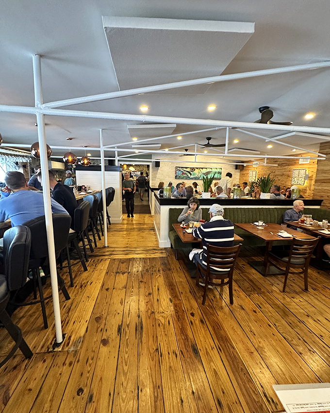 Happy diners enjoying the kind of meal that turns strangers into friends over shared food stories.