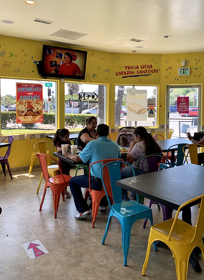 Families gather in the sunshine-yellow dining room, proving great food creates memories that last longer than the meal itself.