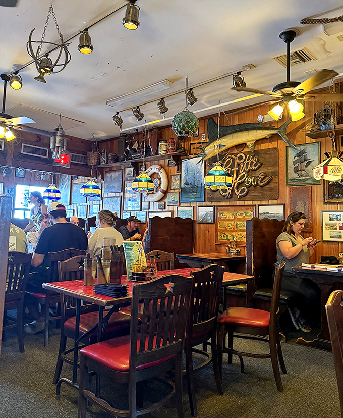 Nautical nostalgia meets dining comfort. Those colorful hanging lamps have witnessed countless "best meal ever" declarations.