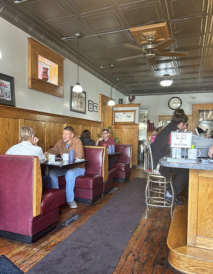 Morning conversations flow as easily as the coffee in these booths, where locals have been solving the world's problems since before smartphones.