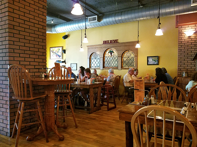 The dining room buzzes with the universal language of satisfied customers. That "BELIEVE" sign isn't just decor&mdash;it's a promise about to be fulfilled.