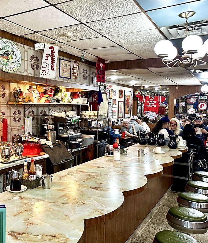 The counter seating offers front-row tickets to the breakfast show, where regulars and staff perform the daily ritual of coffee and conversation.