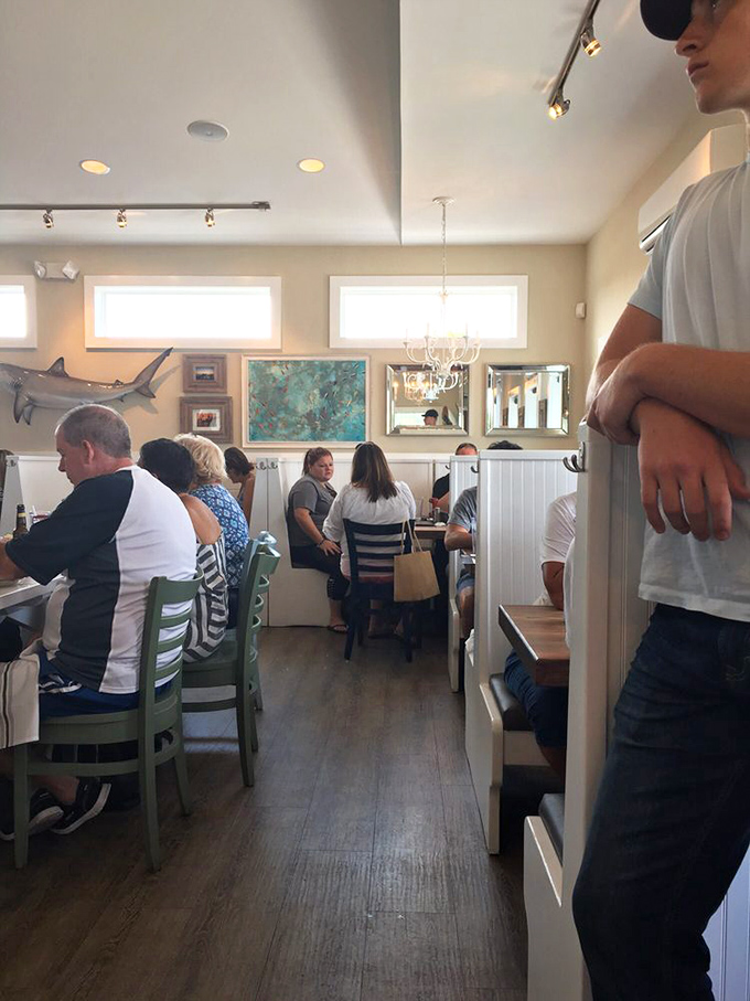 The dining room buzzes with the happy murmur of people having religious experiences with seafood. Notice nobody's looking at their phones&mdash;the food demands full attention.