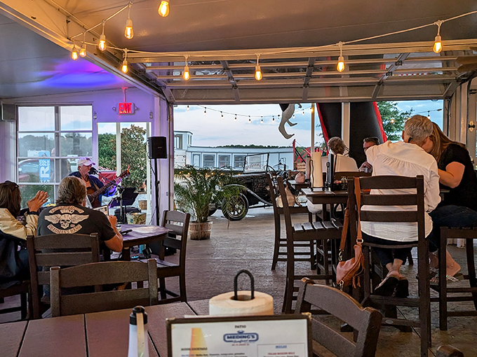The covered patio offers string lights, live music, and that relaxed vibe where nobody's checking their watch or their phones.