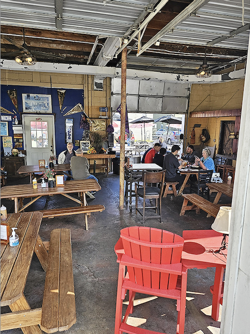 The dining area isn't just a place to eat&mdash;it's a community gathering spot where strangers become friends over the universal language of great BBQ.