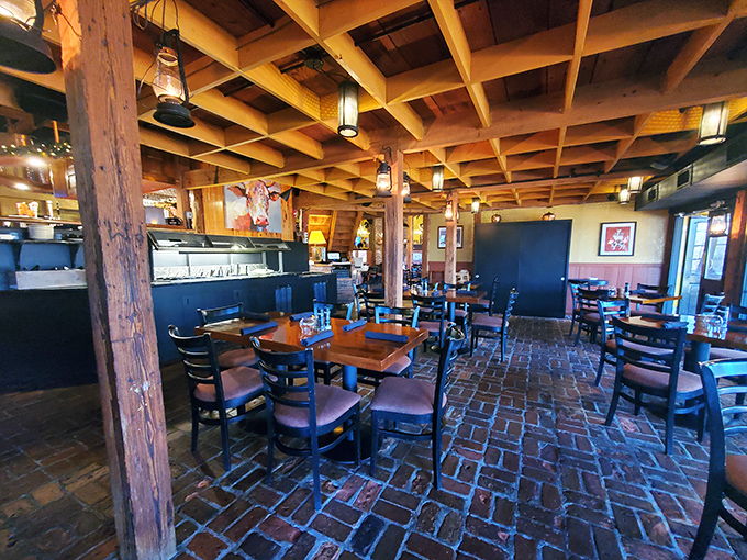 The dining room's exposed beams, brick floors, and wooden posts create an atmosphere where conversations flow as freely as the wine.