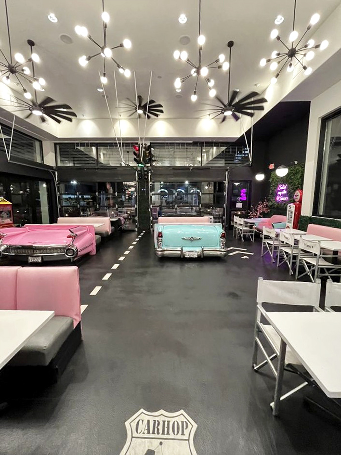At night, the diner transforms into a neon-lit wonderland. The painted road down the center isn't just cute&mdash;it's directing traffic to flavor.