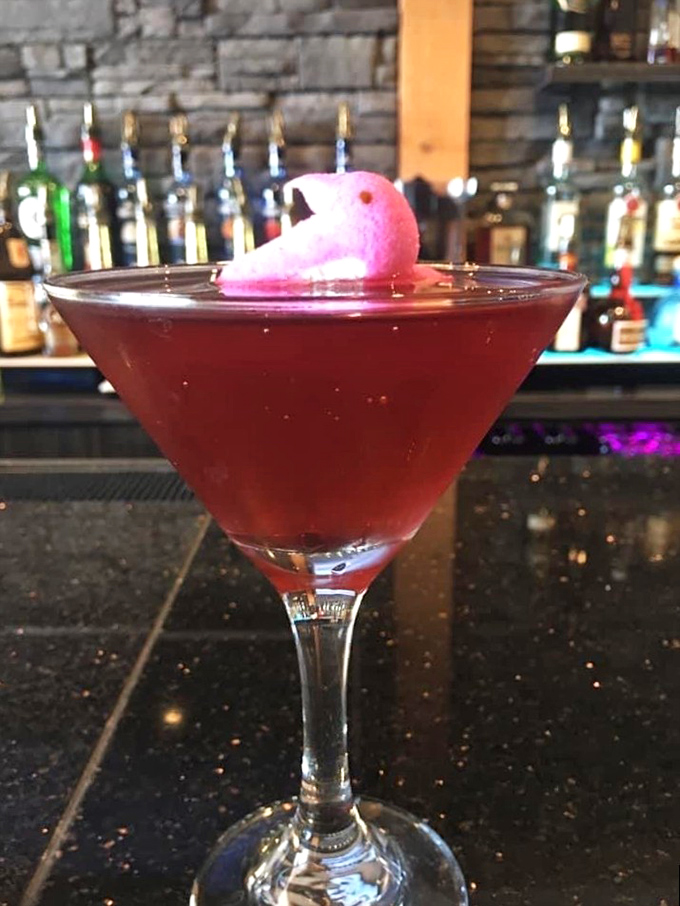 Cocktail artistry in a martini glass. That pink garnish isn't just for looks &ndash; it's the exclamation point at the end of a liquid sentence.