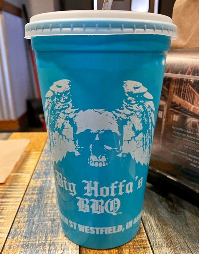 The signature blue cup isn't just a vessel&mdash;it's a pirate-themed badge of honor that says, "Yes, I've discovered the BBQ treasure of Indiana."