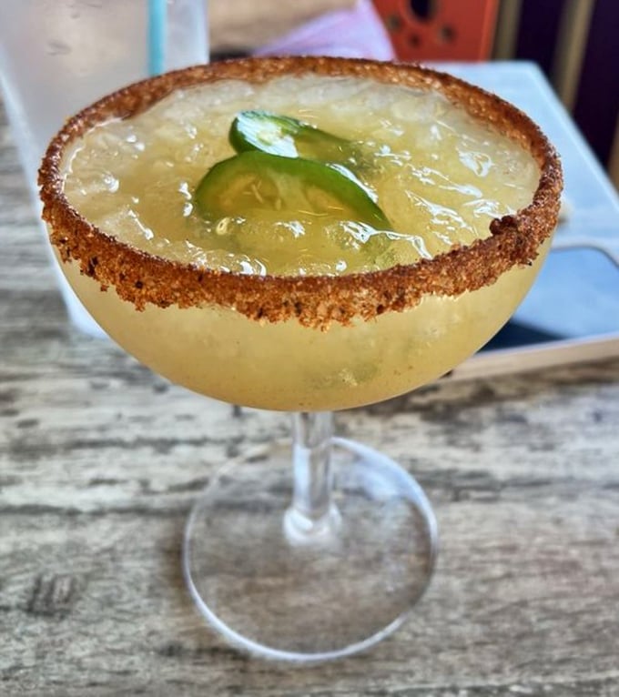 The margarita that launched a thousand sunset celebrations. That salt rim isn't just garnish &ndash; it's a reminder you're dining mere feet from the Gulf.