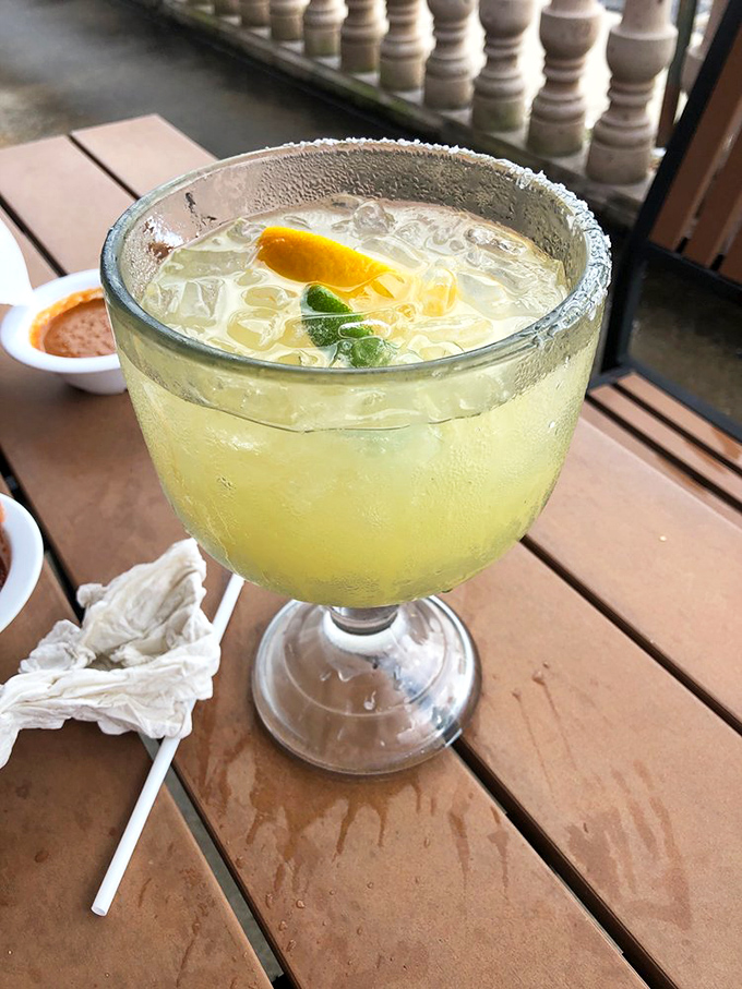 A proper margarita: salt-rimmed, lime-kissed, and cold enough to make you forget you're in Ohio. Vacation in a glass! 