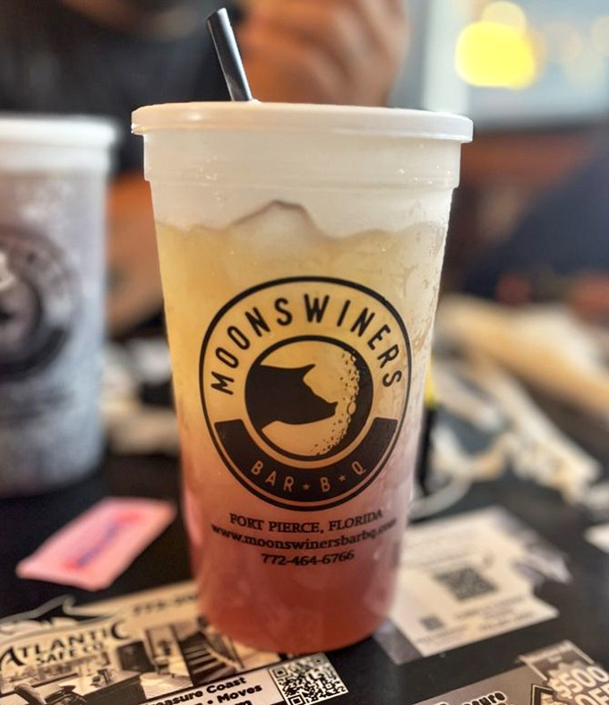 Their signature drink sporting the Moonswiners logo&mdash;half refreshment, half advertisement, all delicious. The straw is just a formality at this point.
