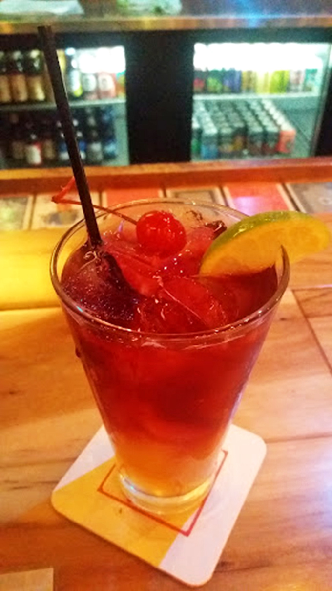 The perfect pizza companion awaits in a frosty glass, ready to cool down those spicy slice adventures.